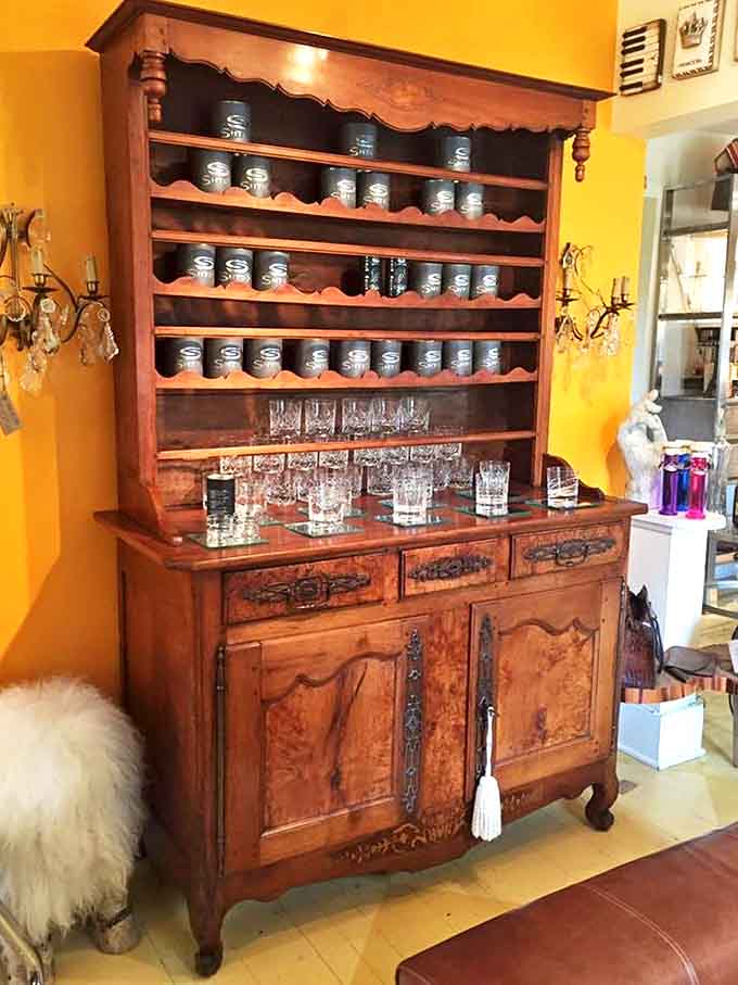 This antique hutch doesn't just display glassware—it showcases liquid history in vessels that have toasted countless celebrations across centuries.