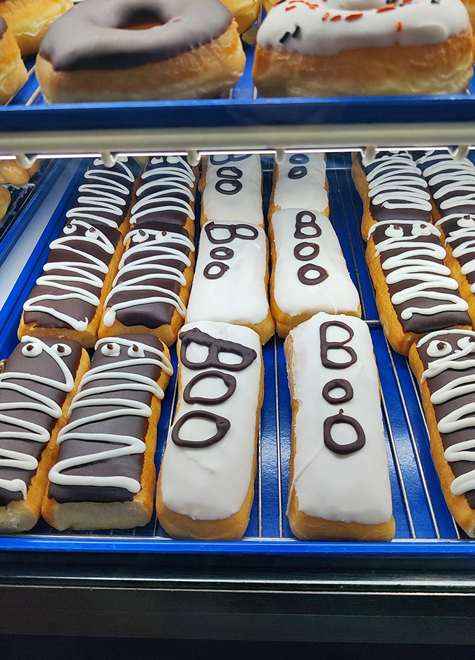 Long johns lined up like edible soldiers, their chocolate and vanilla stripes standing at attention, ready for your breakfast battle.