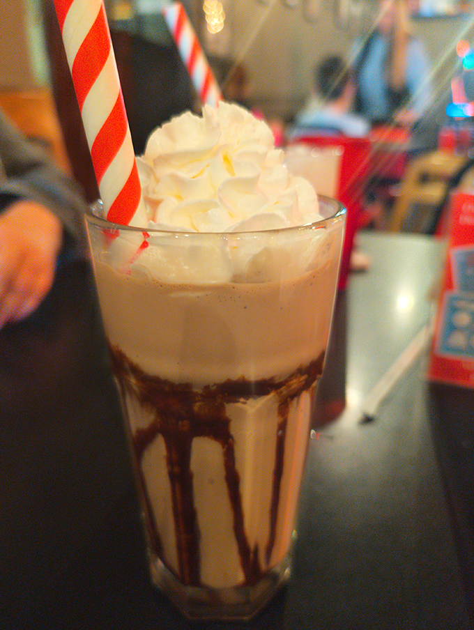 Sweet architecture &ndash; layers of flavor topped with a cloud of whipped cream and that essential cherry create a dessert worth traveling for.