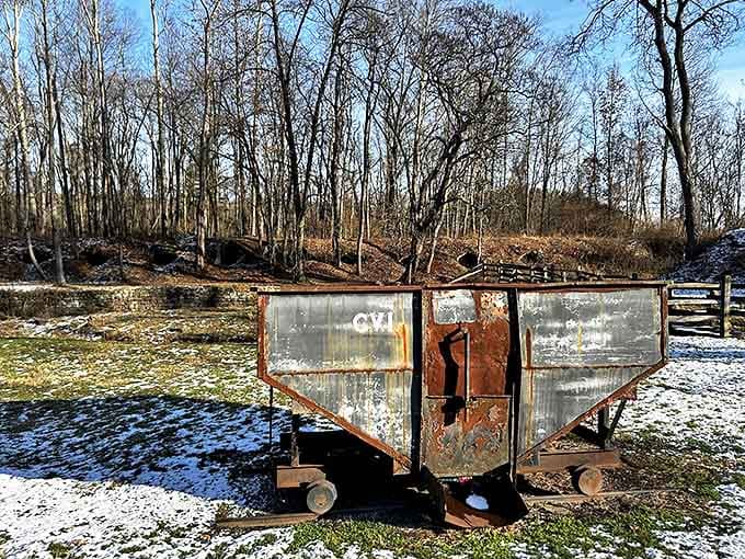 This abandoned coal cart sits like a forgotten toy, a poignant reminder of the transportation system that once fed these brick behemoths.