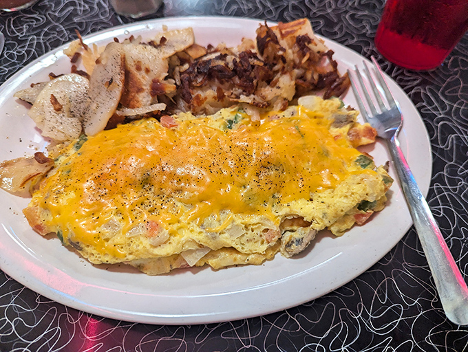 Cheese doesn't just top this omelet &ndash; it becomes one with it, creating a harmony of flavors that makes morning people out of night owls.