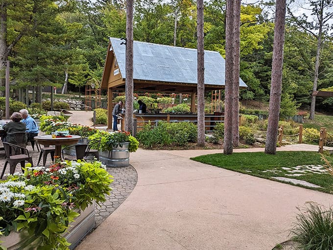 Lush gardens frame this outdoor pavilion, where morning coffee tastes better and conversations flow easier than they do in the real world.