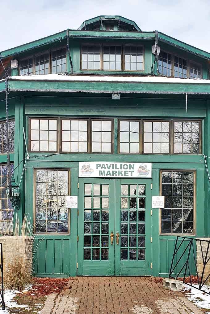 The Pavilion Market's distinctive green exterior and French doors house unique shopping experiences that feel worlds away from conventional retail spaces.