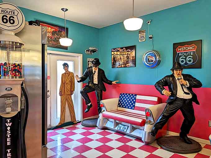 The Blues Brothers stand guard in the corner, seemingly ready to break into "Soul Man" while diners enjoy their meals in retro-perfect booths.