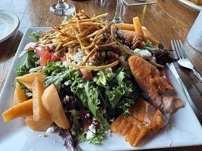 Fresh meets flavorful in this artful salad &ndash; crisp greens, smoked fish, and seasonal ingredients create a plate as beautiful as the lake views outside.