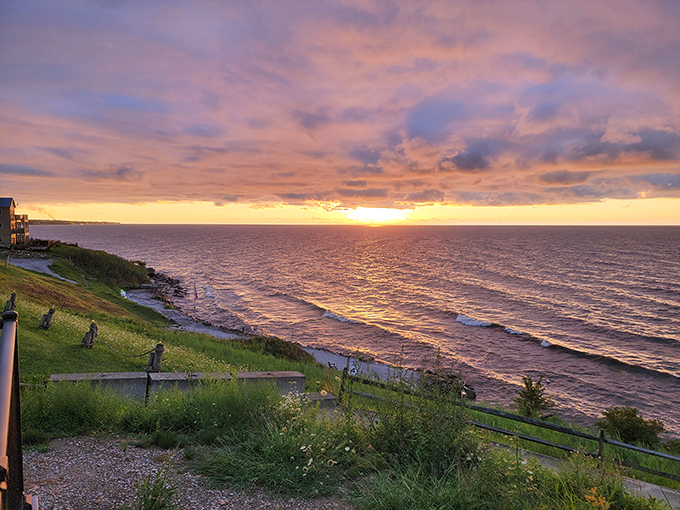 The golden hour transforms Breakwater Beach into a photographer's dream, with warm light bathing the landscape in amber hues.