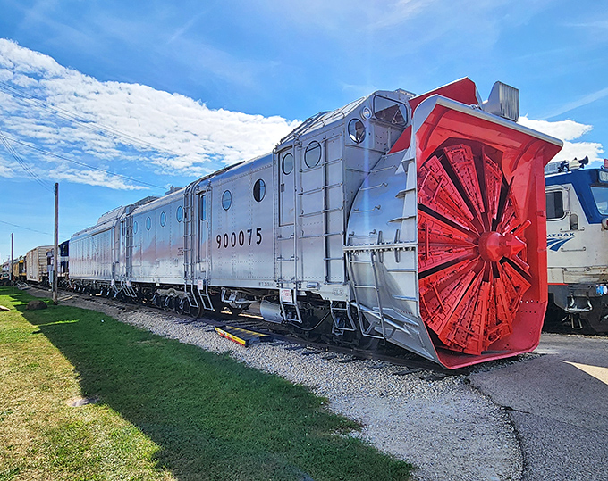 This silver snowplow giant once battled winter's worst – its massive red wheel designed to fling snow far from vital railway lines.