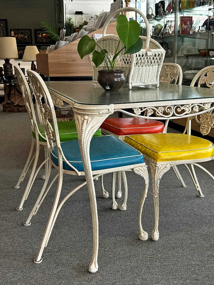 This mid-century dining set with rainbow-hued chairs isn't just furniture &ndash; it's a portal to family dinners circa 1965.