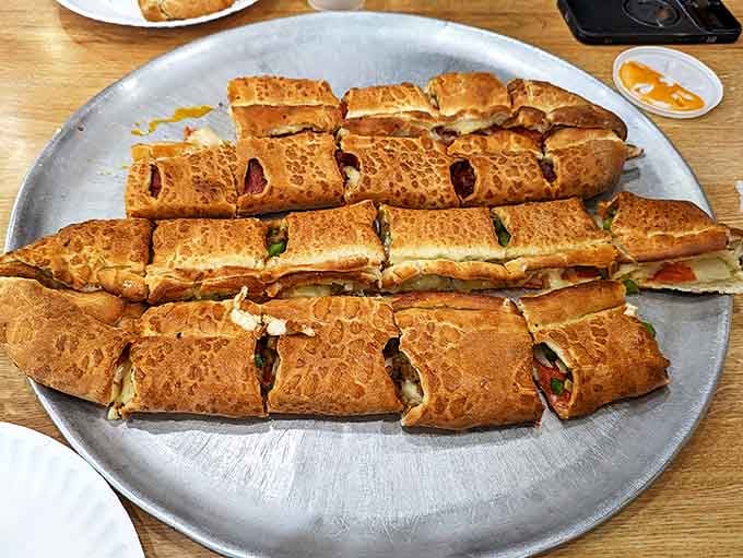 Tray of sliced pide: These Turkish-inspired flatbreads get the Big Al's treatment&mdash;sliced for sharing but so good you'll want your own.