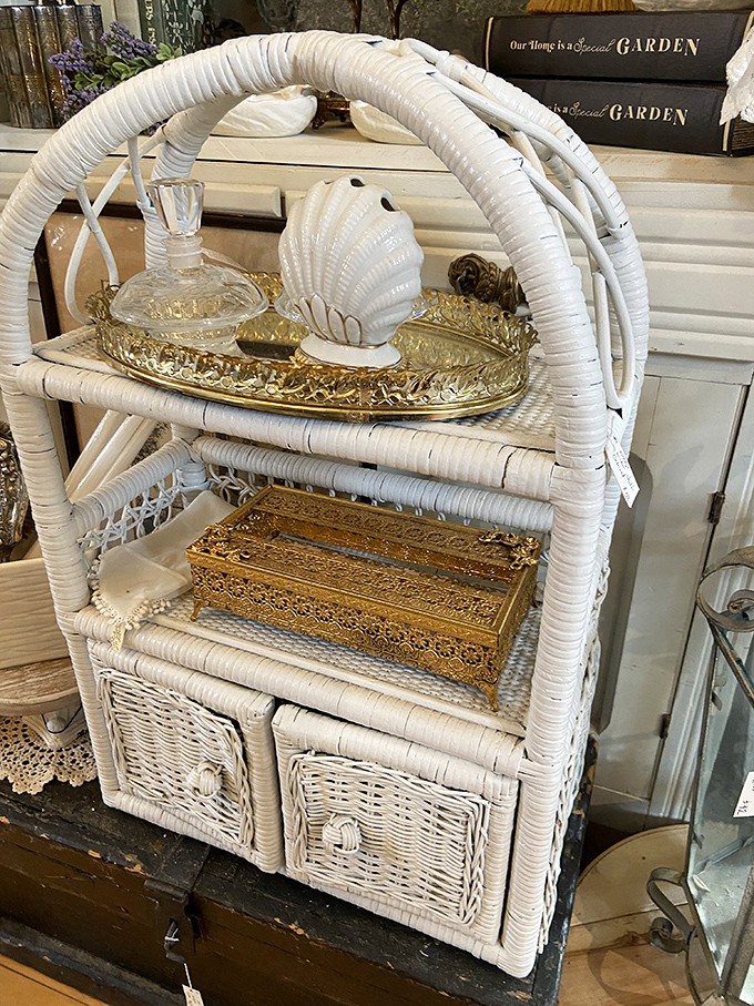 Wicker wonderful! This pristine white rattan shelf offers beachy elegance that would make even the most dedicated minimalist consider a coastal cottage aesthetic.