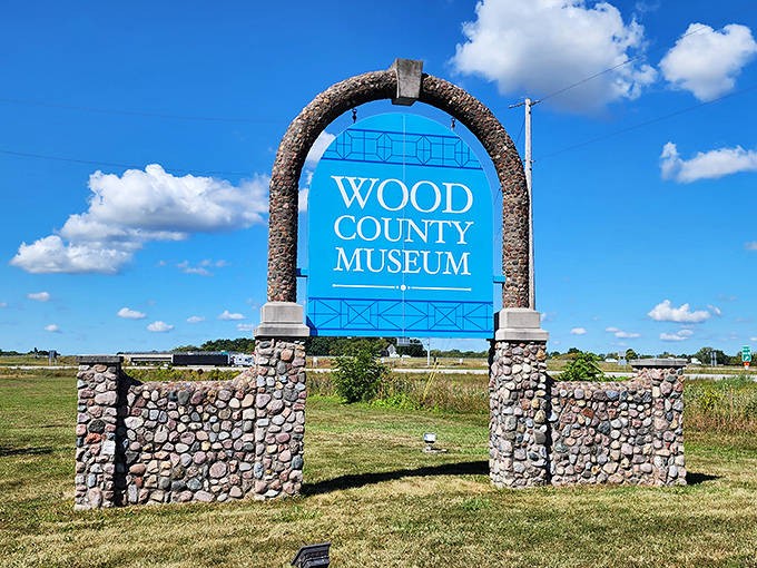 The Wood County Museum's distinctive stone archway stands as a portal to local history, inviting curious minds to discover stories of yesterday.