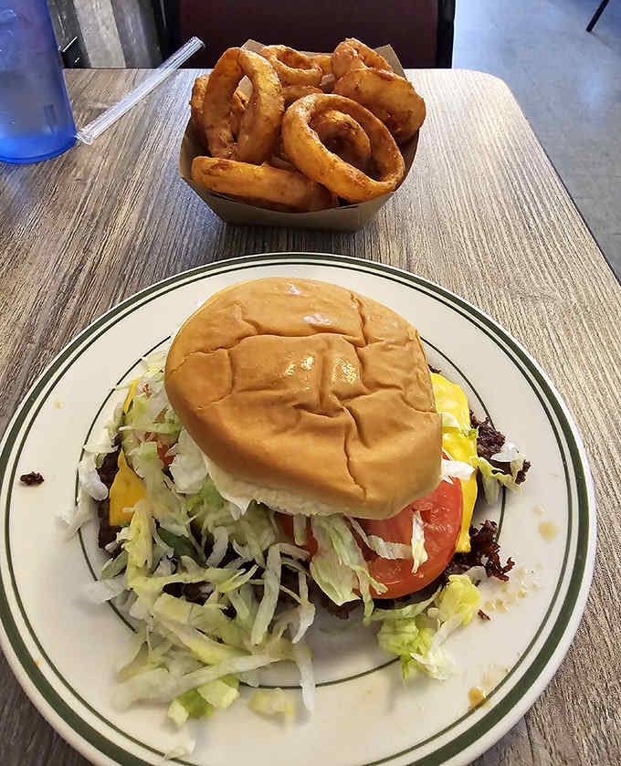 When a regular burger won't do, add crispy golden onion rings that shatter with each bite &ndash; comfort food engineering at its finest.
