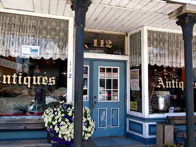 That blue door and vintage storefront whisper "come inside" louder than any modern advertising ever could.