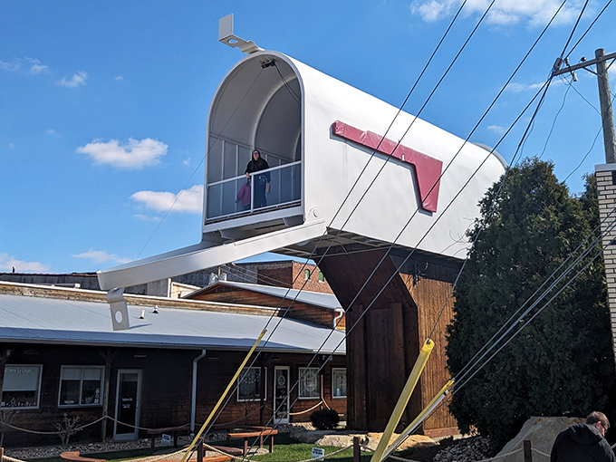 Neither snow nor rain nor dark of night will keep you from spotting this 32-foot functional mailbox, complete with a giant red flag.