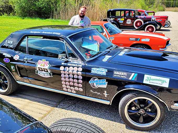 The '68 Mustang sits proudly with its collection of road rally badges &ndash; each sticker a passport stamp in its mechanical journey.