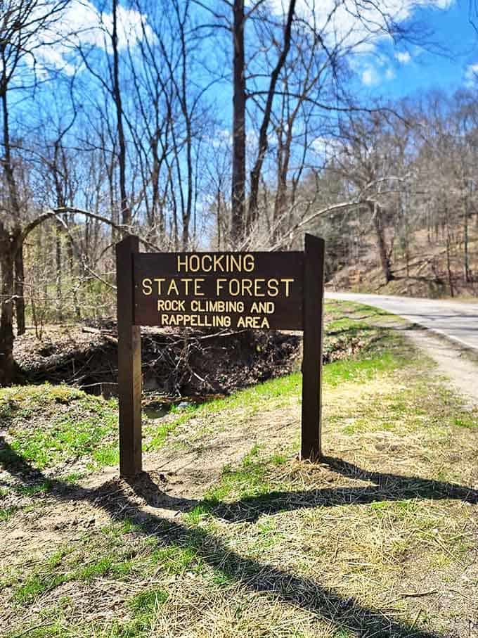 The official welcome sign marks your entry into a world of vertical sandstone cliffs perfect for rock climbing enthusiasts and thrill-seekers.