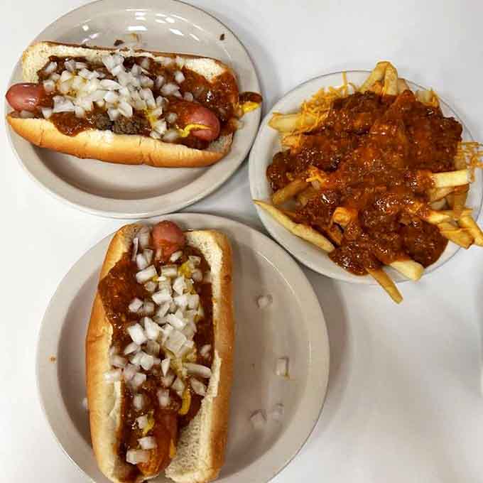 A feast fit for Motor City royalty: two variations of their legendary Coney dogs alongside a mountain of chili cheese fries.