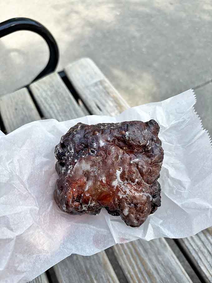 This apple fritter is the size of your face and absolutely unapologetic about it, glazed and studded with fruit like autumn decided to become portable.