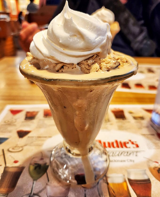 This isn't just dessert, it's a religious experience in a glass &ndash; thick, creamy, and topped with a cloud of whipped cream. 