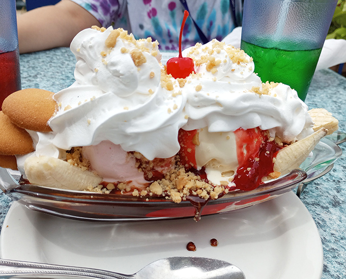 This banana boat sails straight to dessert nirvana, loaded with ice cream treasures, whipped cream clouds, and that signature cherry lighthouse.