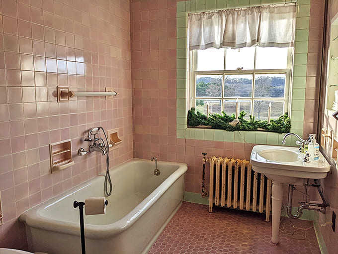 Bathroom: Pink tiles and a classic claw-foot tub transform daily routines into luxurious rituals&mdash;no wonder people took fewer showers back then!