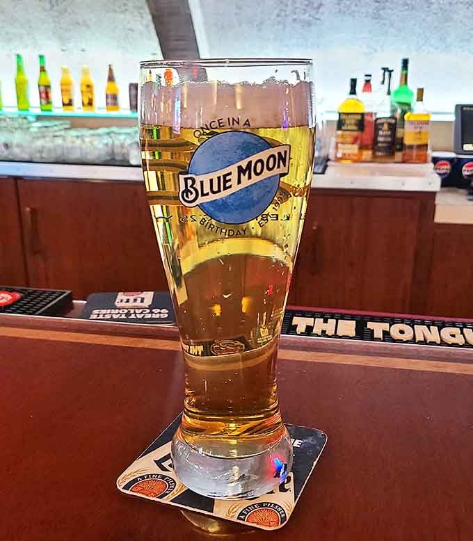 Schuler's craft beer selection showcases Michigan's impressive brewing scene, served in branded glassware that many patrons have "accidentally" collected over the years.