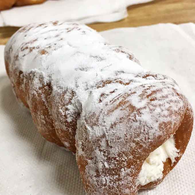 The cream horn is basically a flaky pastry hug filled with sweet cream that'll make you forget your troubles.