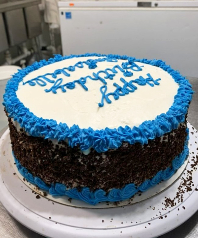 A birthday cake that says "celebration" better than words ever could&mdash;layers of chocolate with perfect blue piping.