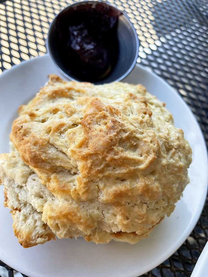 The biscuit that launched a thousand sighs, golden-topped and ready for its close-up before being slathered with house-made jam.