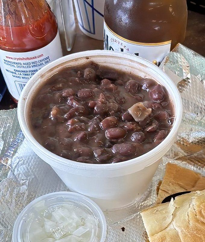 These aren't your average black beans &ndash; simmered to velvety perfection, they're practically a religious experience in a styrofoam cup.