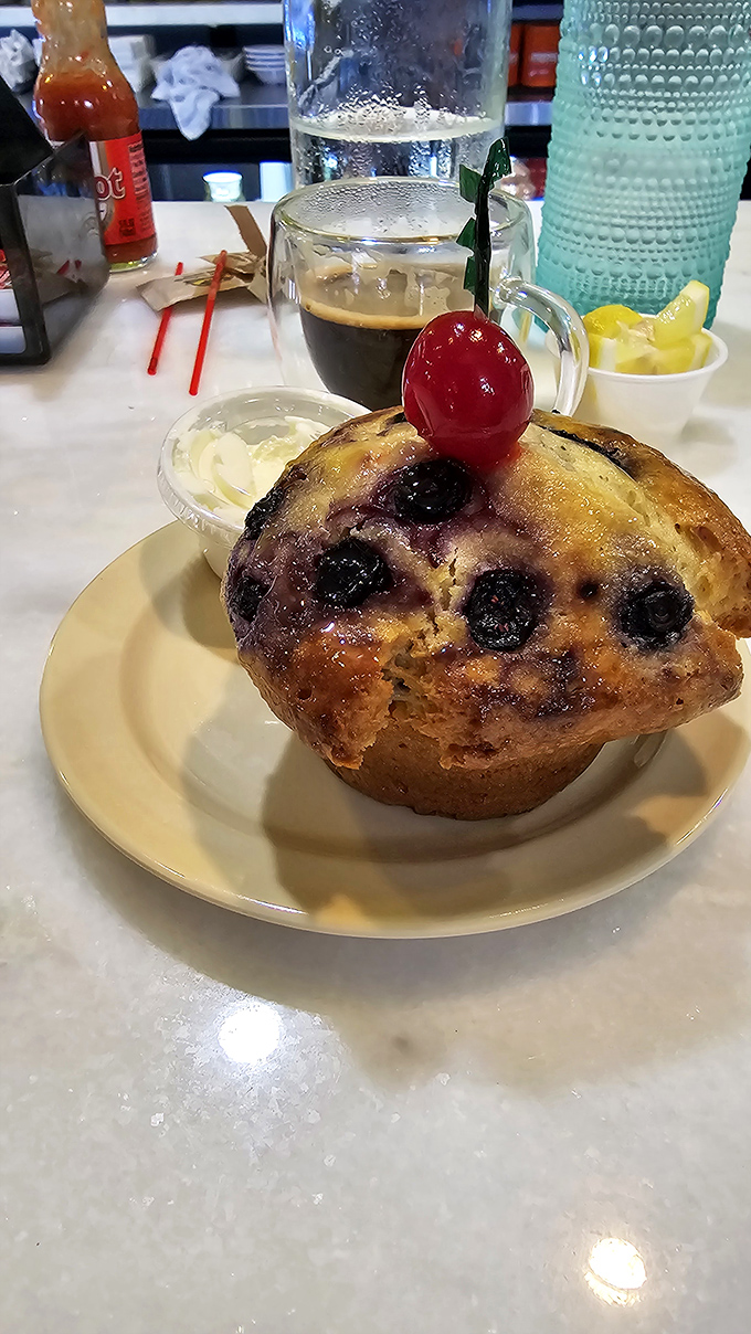A blueberry muffin that could convert pastry skeptics &ndash; crowned with a cherry and served alongside rich coffee.