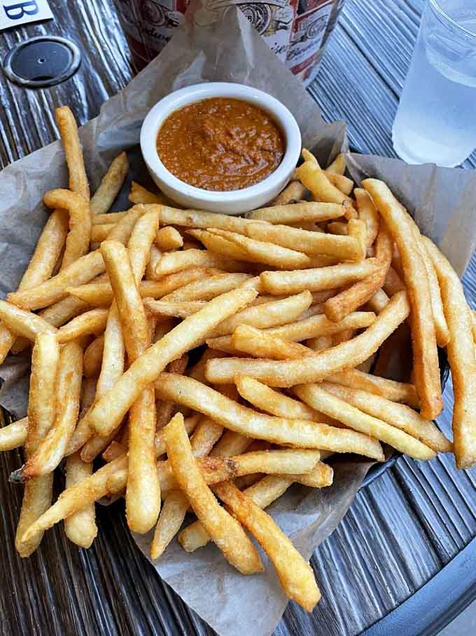 A mountain of crispy chips with curry sauce for dipping, because sometimes simple pleasures are the best pleasures in life.