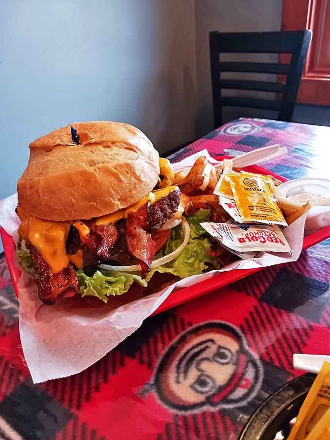 The legendary Buckeye Burger arrives like a delicious skyscraper of beef, bacon, and fresh toppings that requires a strategic eating plan.