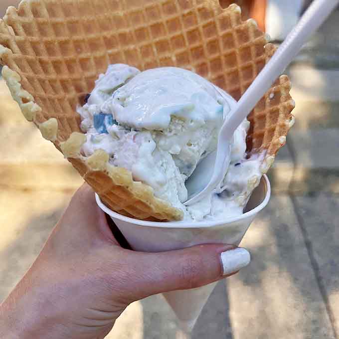 Ice cream innovation at its finest&mdash;creamy scoops nestled between fresh waffle cookies create a handheld dessert that's both elegant and delightfully messy.