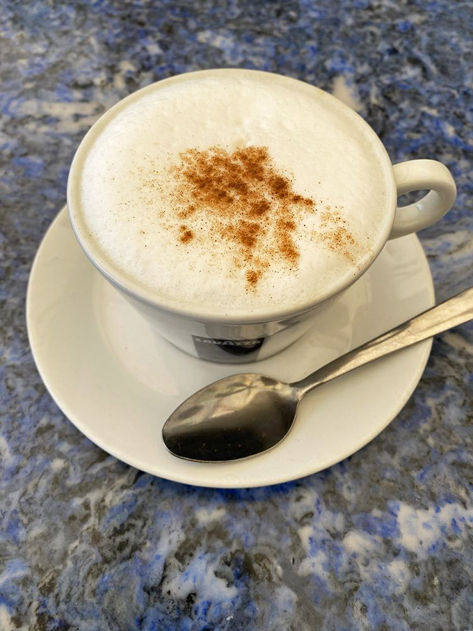 This isn't just coffee &ndash; it's a proper cappuccino with a dusting of cinnamon that somehow tastes better in a diner mug than fancy caf&eacute;s.