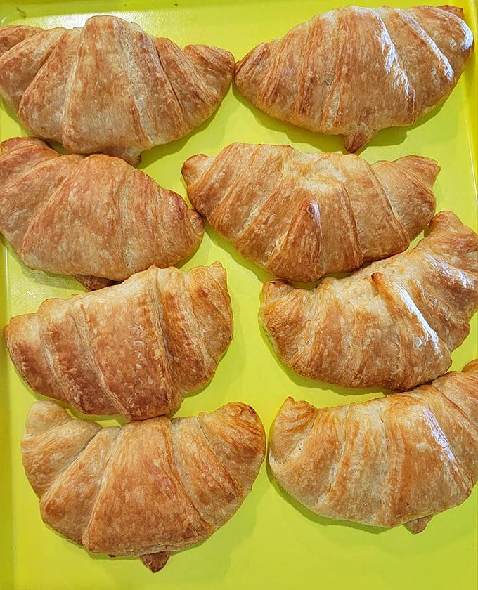 Perfectly laminated croissants with their honeycomb interior reveal the baker's patience and skill&mdash;each flaky layer a buttery triumph.