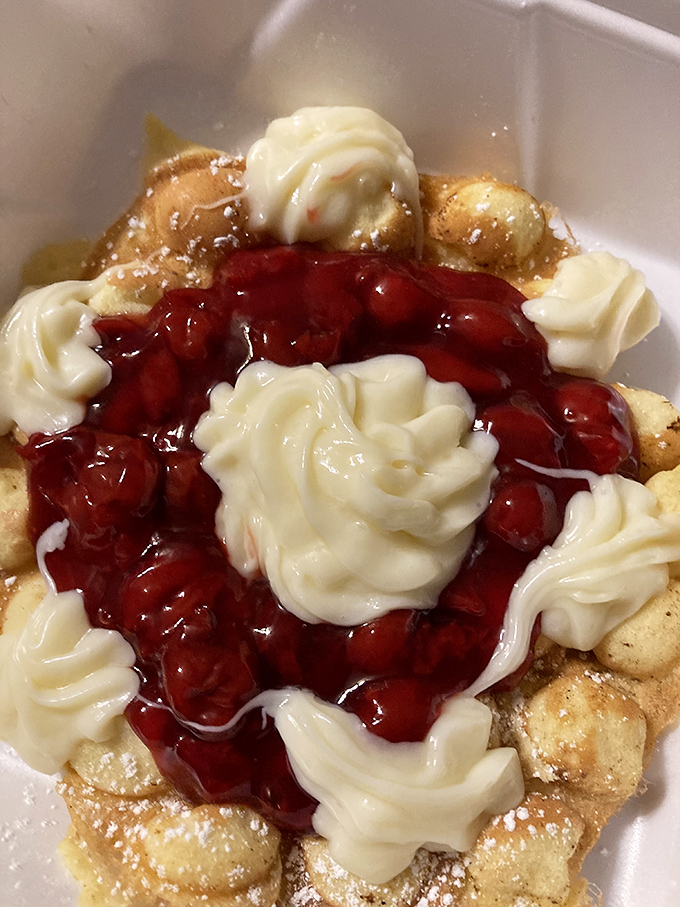 The cherry-topped waffle isn't just breakfast &ndash; it's a sweet-tart flavor symphony with whipped cream high notes that demands a standing ovation.