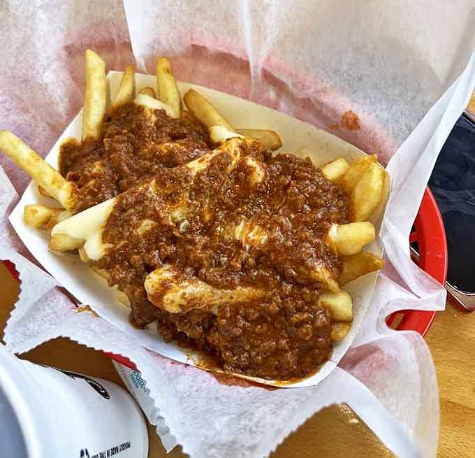 A glorious mess of house-made chili cascading over fresh-cut fries&mdash;the kind of indulgence that requires both a fork and zero regrets.