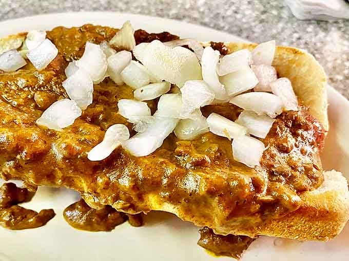 The chili dog comes smothered in a rich, beefy sauce that's been perfected over decades &ndash; comfort food that speaks directly to your soul.
