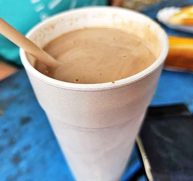 A chocolate shake so thick you'll need that straw as both a tool and a structural support &ndash; worth every bit of effort to savor each creamy sip.