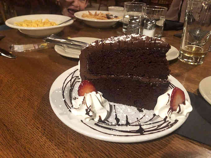 This chocolate cake isn't just dessert; it's a monument to cocoa-based decadence that makes sharing feel like an act of tremendous generosity.