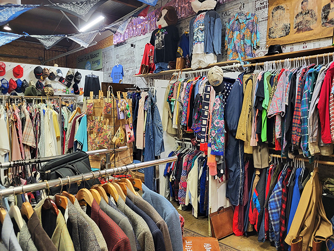 Vintage clothing racks burst with color and texture – each garment a time capsule of fashion history waiting for its second life.