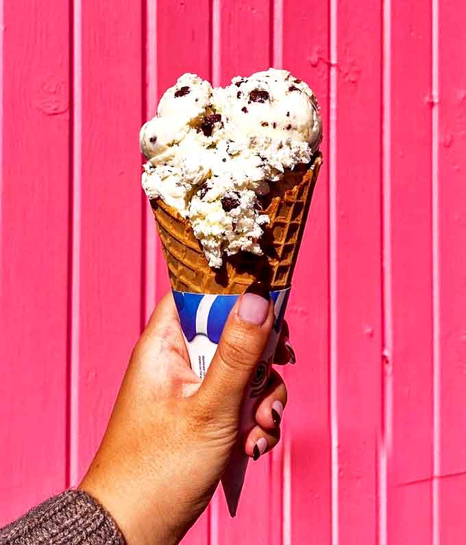 Cookie-studded ice cream against a weathered red backdrop &ndash; a simple pleasure that somehow makes everything right with the world.