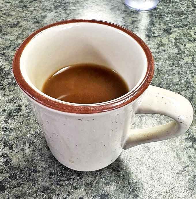 The lifeblood of any proper breakfast joint – strong coffee served in sturdy mugs, ready to transform morning zombies into functioning humans.