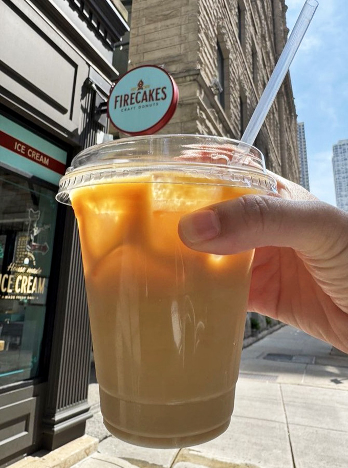 That perfect amber cold brew, catching the light like liquid gold, ready to cut through sweetness with its smooth, robust character.