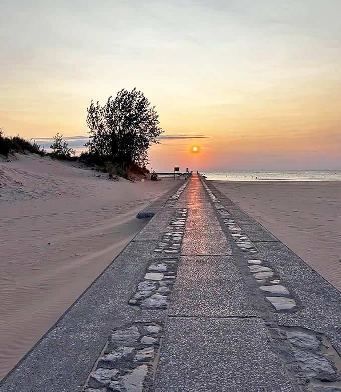 This concrete path to beach bliss leads straight into a sunset that looks like nature's version of a motivational poster.