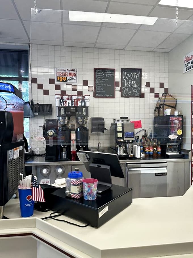 The counter area where magic happens, complete with coffee station and enough equipment to keep the donut production line humming 24/7.