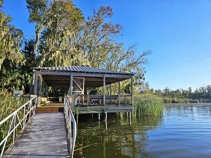 This rustic pavilion hovers over the water like a contemplation station, where time is measured in ripples and bird calls.