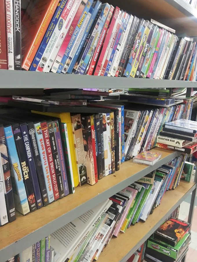 Yesterday's blockbusters and forgotten gems line these shelves, offering entertainment bargains that streaming services can't match.