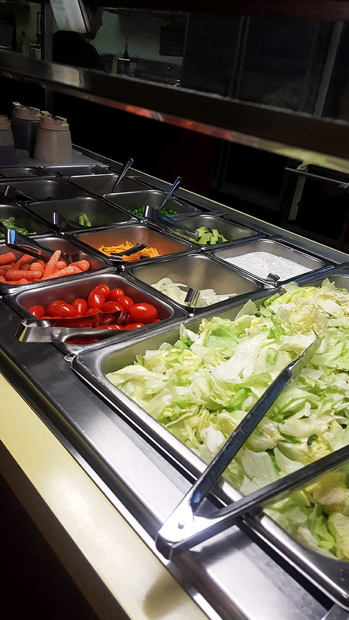 The salad bar offers fresh simplicity &ndash; crisp vegetables and classic toppings that remind you sometimes the basics, done right, are all you need.